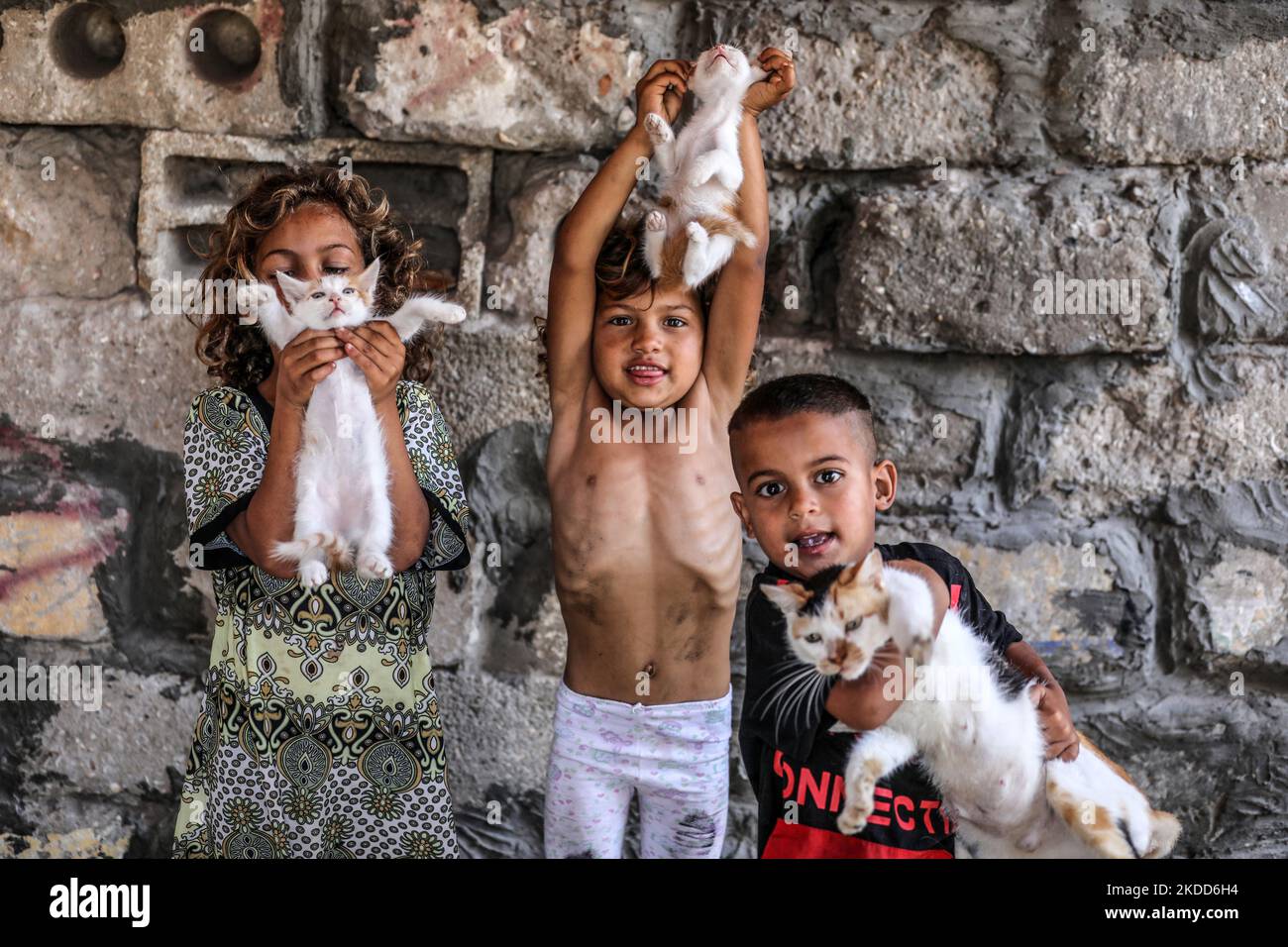 Palestinian children play inside their home in a poor neighborhood in ...