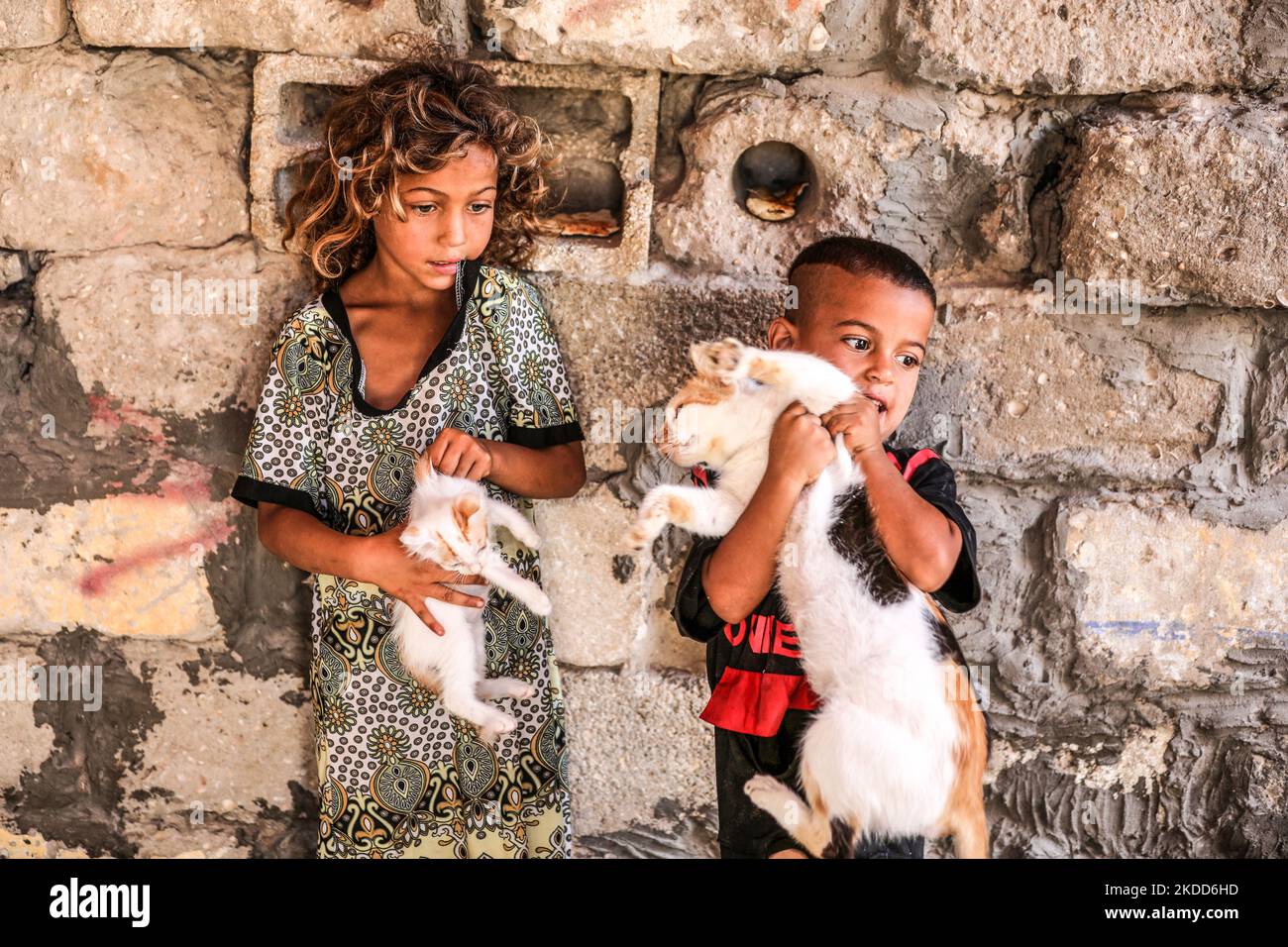 Palestinian children play inside their home in a poor neighborhood in ...