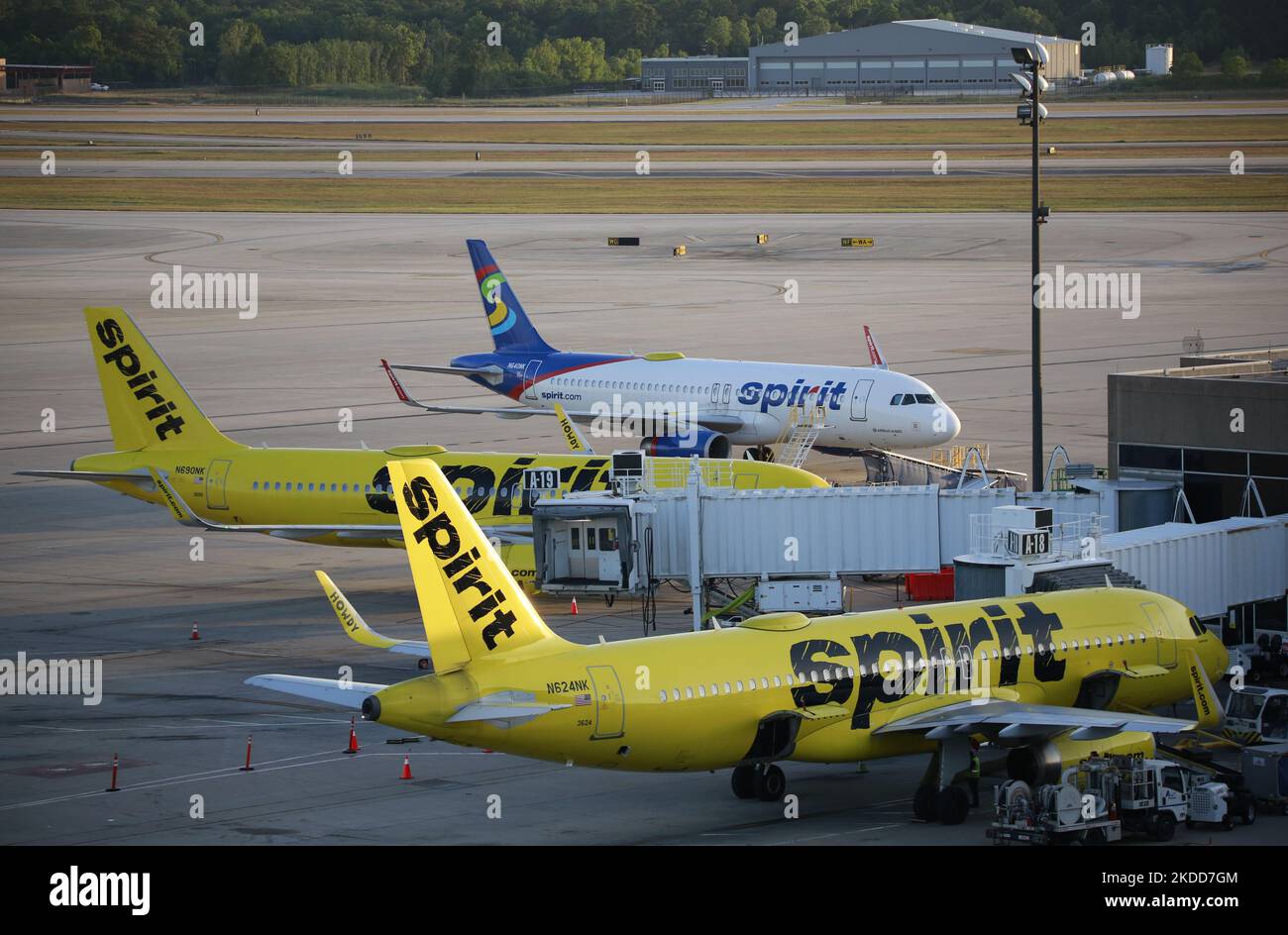 Spirit Airlines planes, one still painted with their old logo, can be ...
