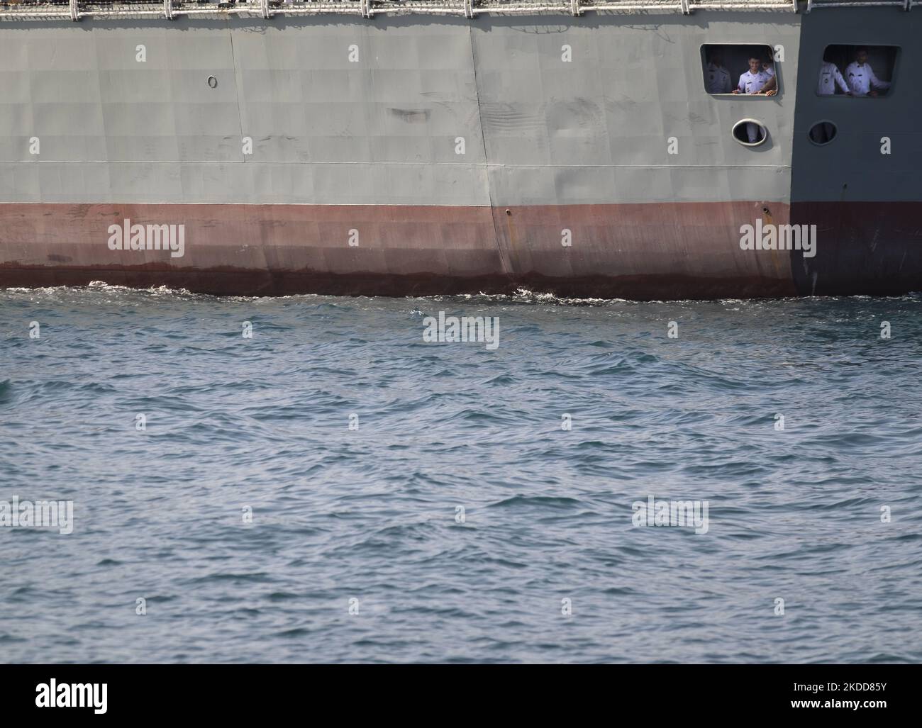 Iranian Navy personnels monitor an area as they stand at the Sahand ...