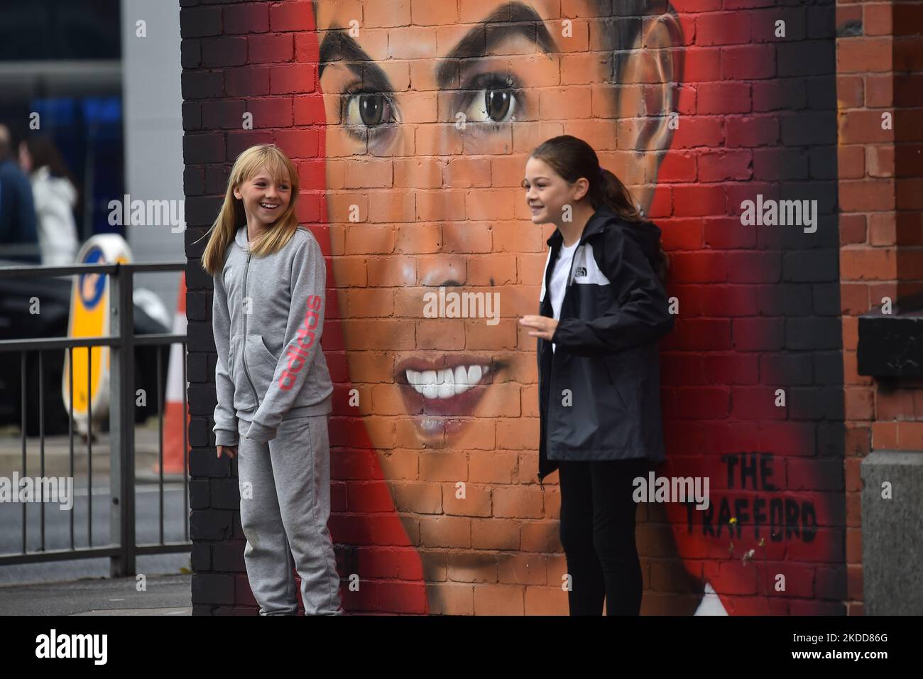 Fans pose with a Cristiano Ronaldo mural before the UEFA Women's Euro ...