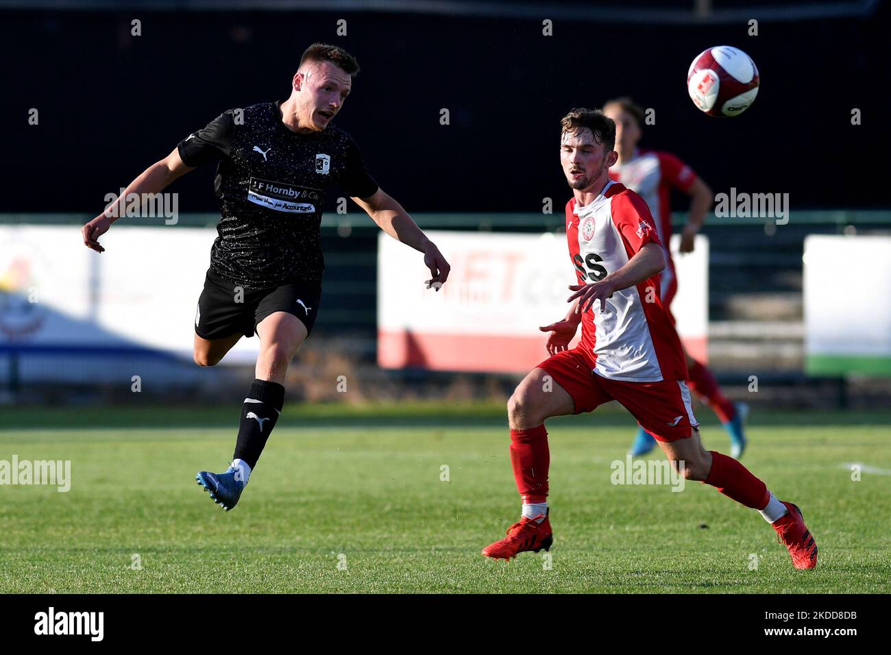 Barrow trialist #9 tussles with Ashton's Ben Hough during the Pre ...
