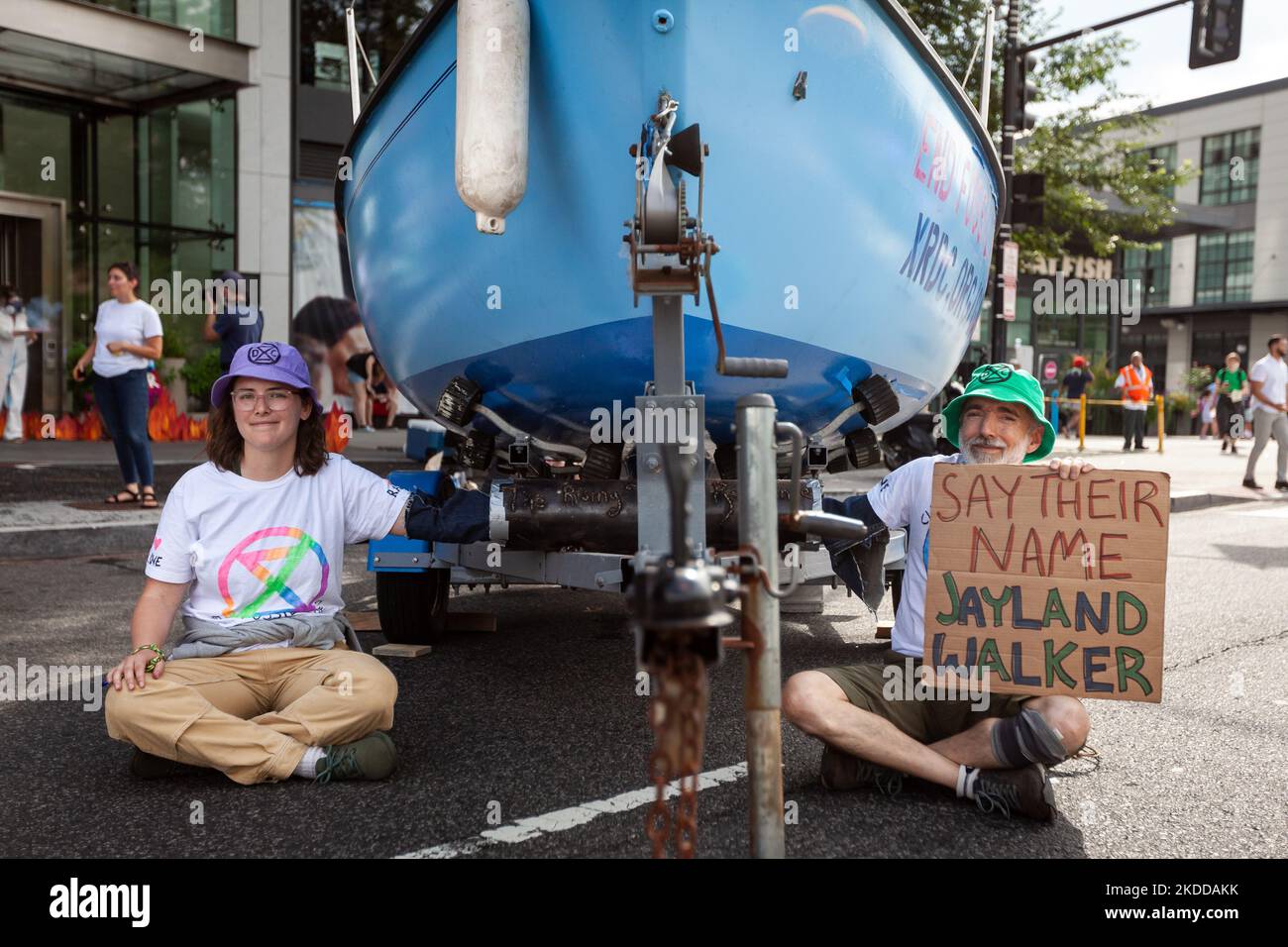 Two members of Extinction Rebellion DC sit chained to a boat outside ...