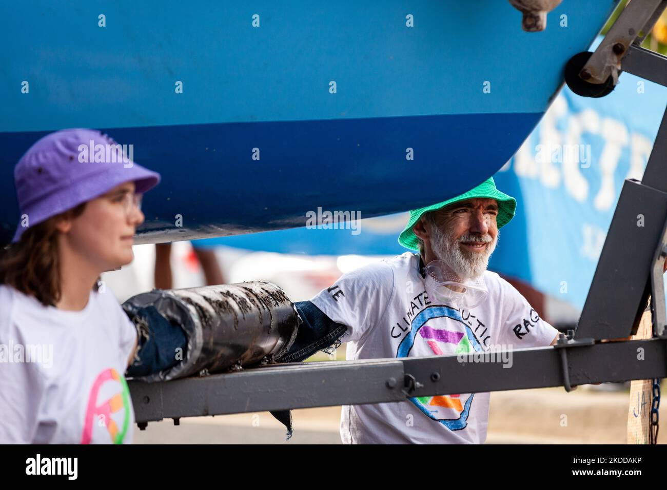 Two members of Extinction Rebellion DC sit chained to a boat outside ...