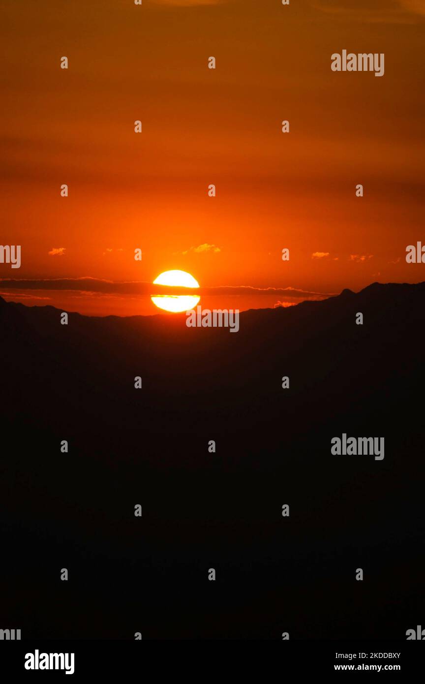 The sun rising from the Eastern part of the world on a vertical shot ...