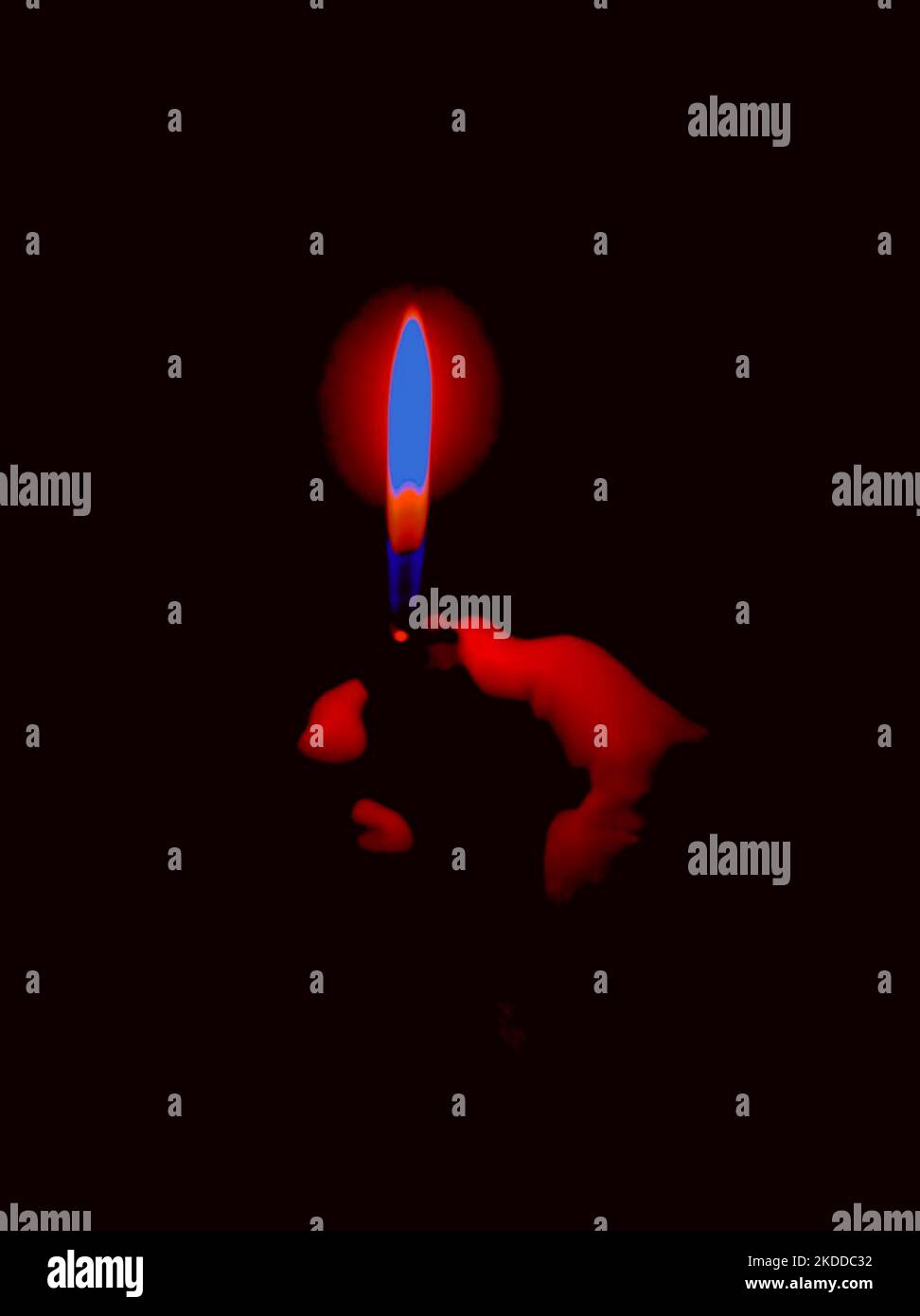 A hand holding Red fire lighter in the dark Stock Photo - Alamy