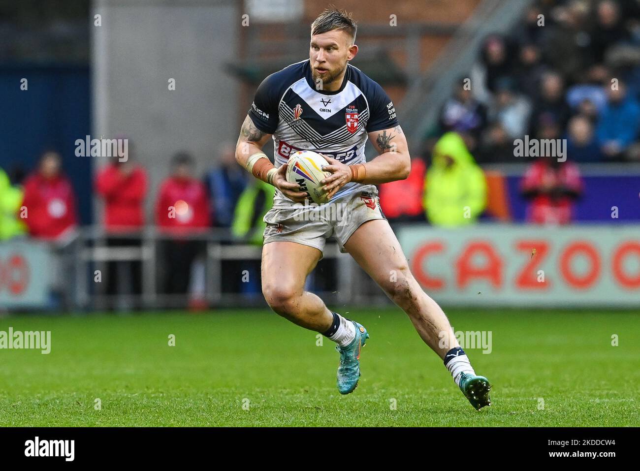Mike Cooper of England makes a break during the Rugby League World Cup ...