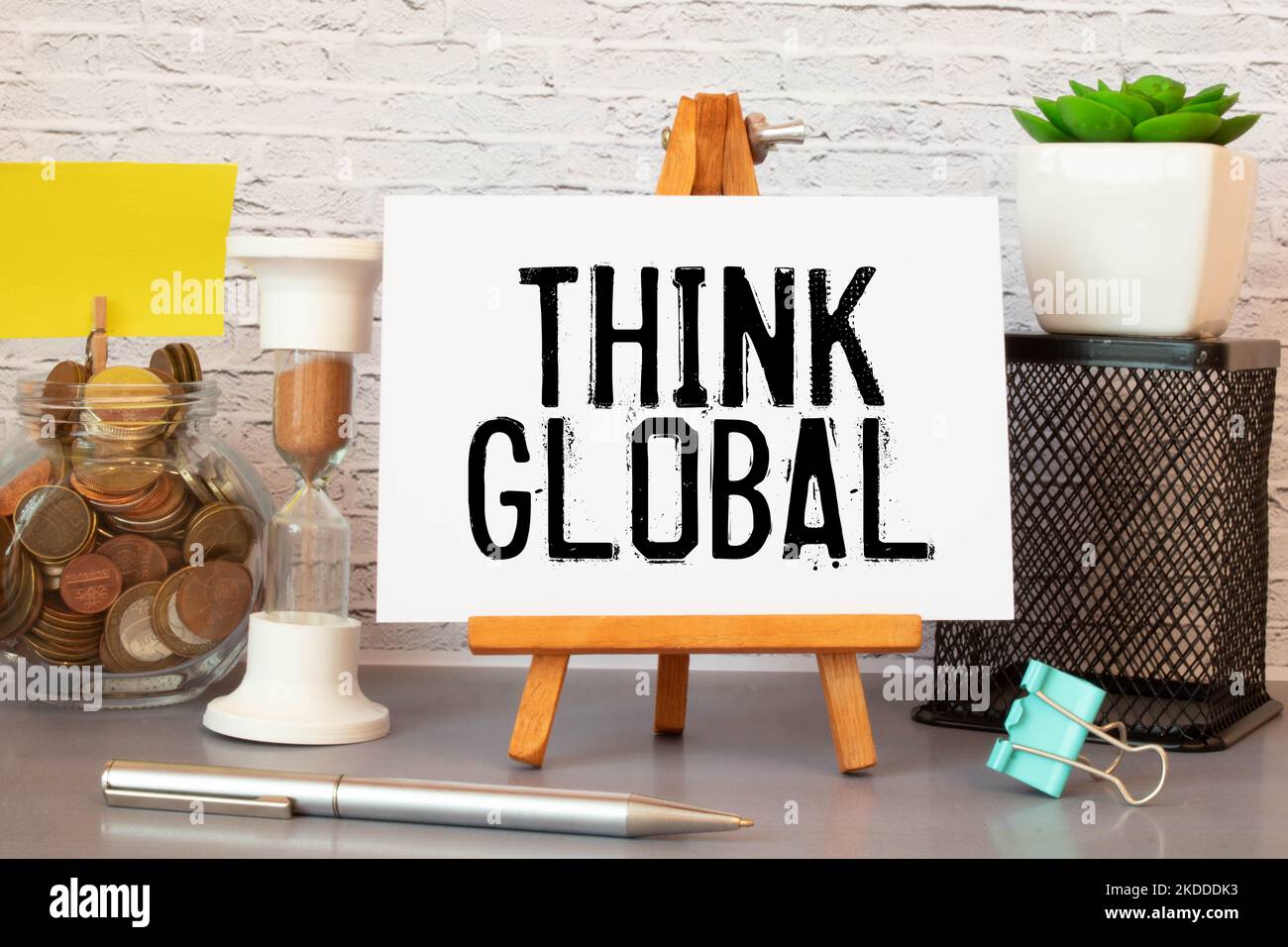 Think globally, act locally reminder - handwriting on a napkin Stock ...