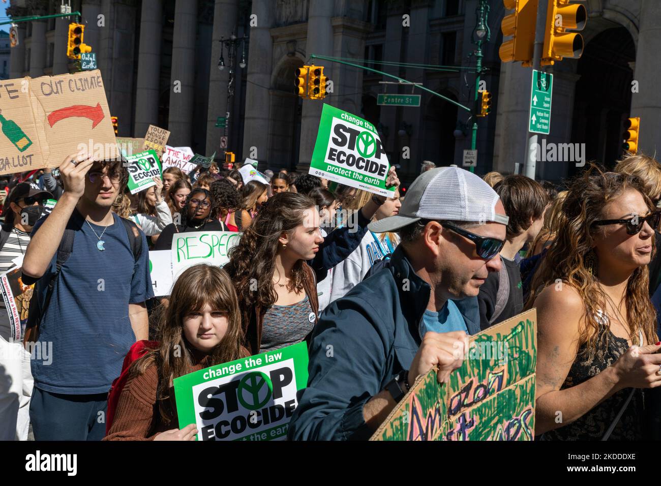 A shot of activists with posters and cardboard signs marching to ...