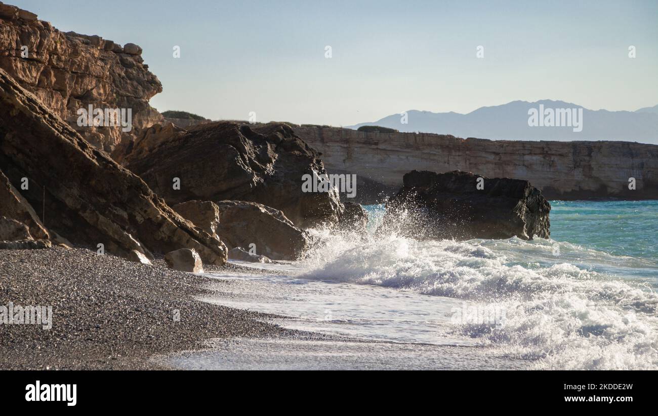 The sea waves washing the rocks on the beach Stock Photo - Alamy