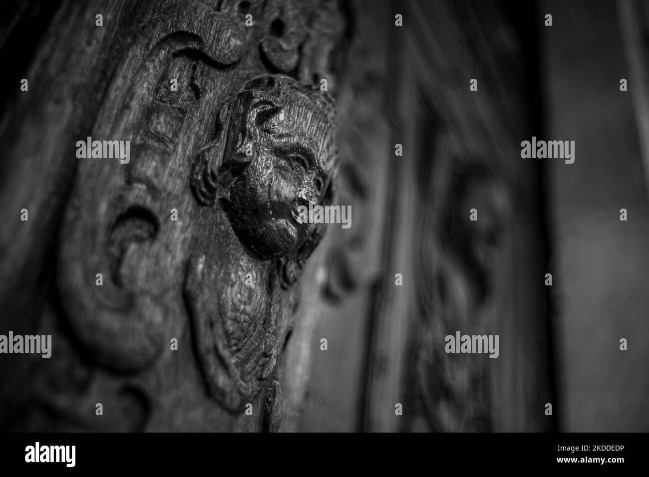 A low angle selective focus grayscale of a detailed design of a wooden ...