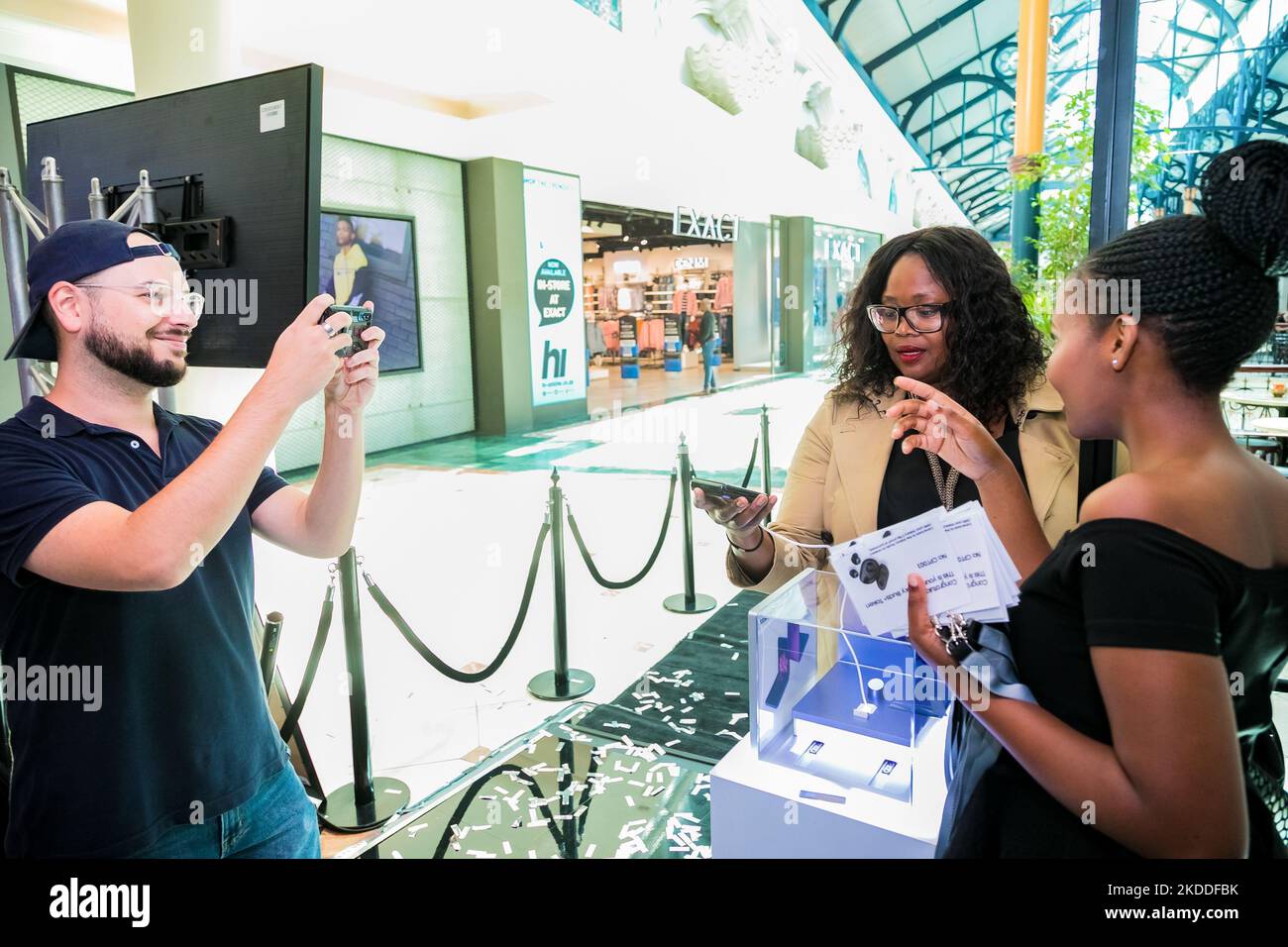 The customers viewing Samsung phones at mall pop-up retail stand Stock ...