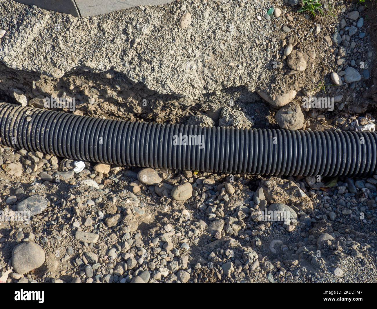 Underground communications pipe. Black elastic tube for wires. Repair ...