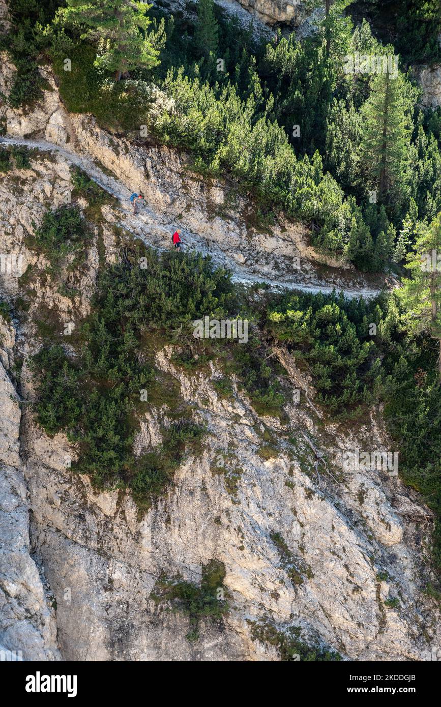 Hiking through fragile limestone rock in the Rienz valley of South ...