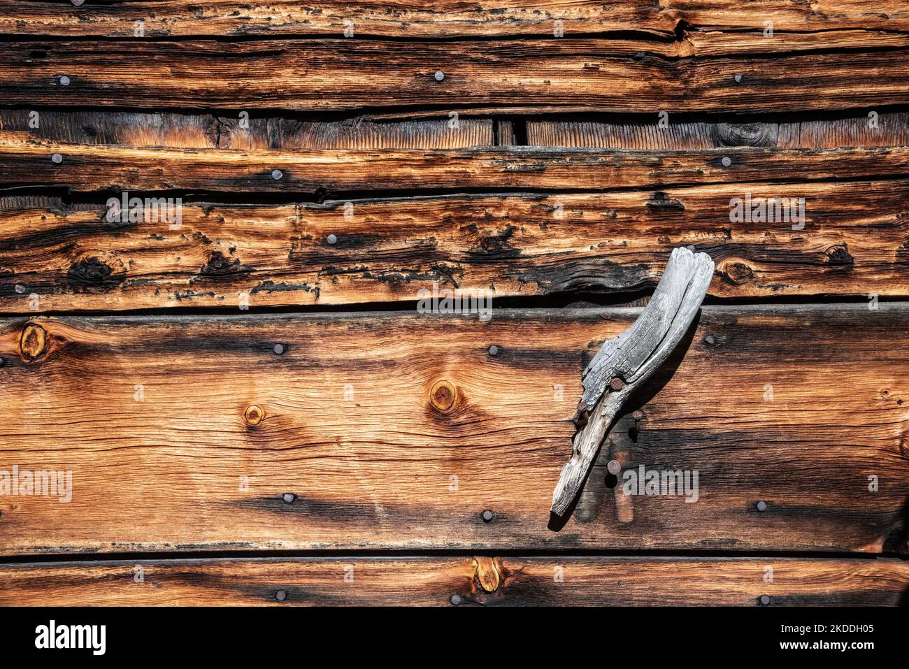 Closeup of the facade of a typical Alpine hut, the Dolomite Alps in ...