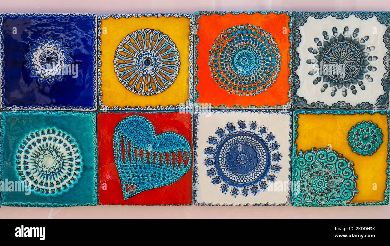 New glazed ceramic tiles, embossed colorful Azulejos, on building wall ...