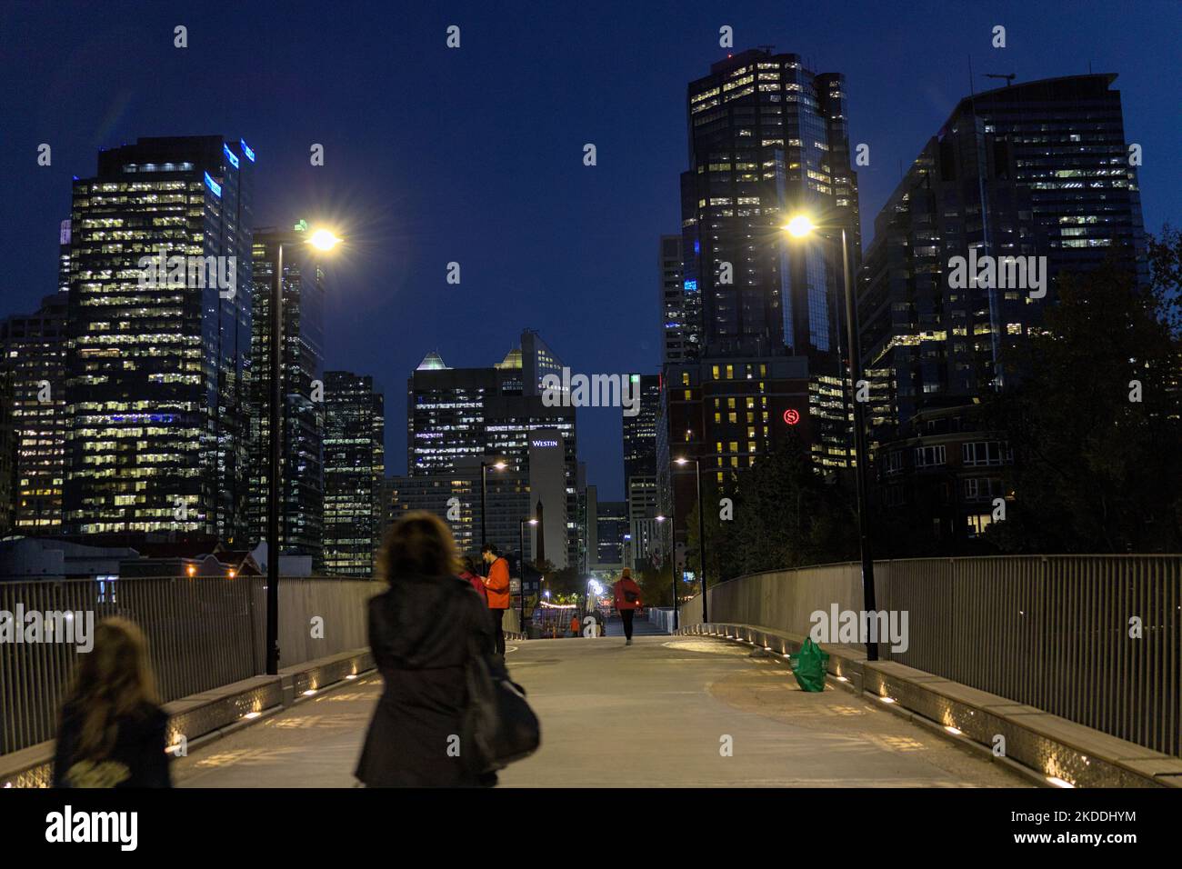 People crossing the bridge over the Bow River at night, Calgary Stock ...