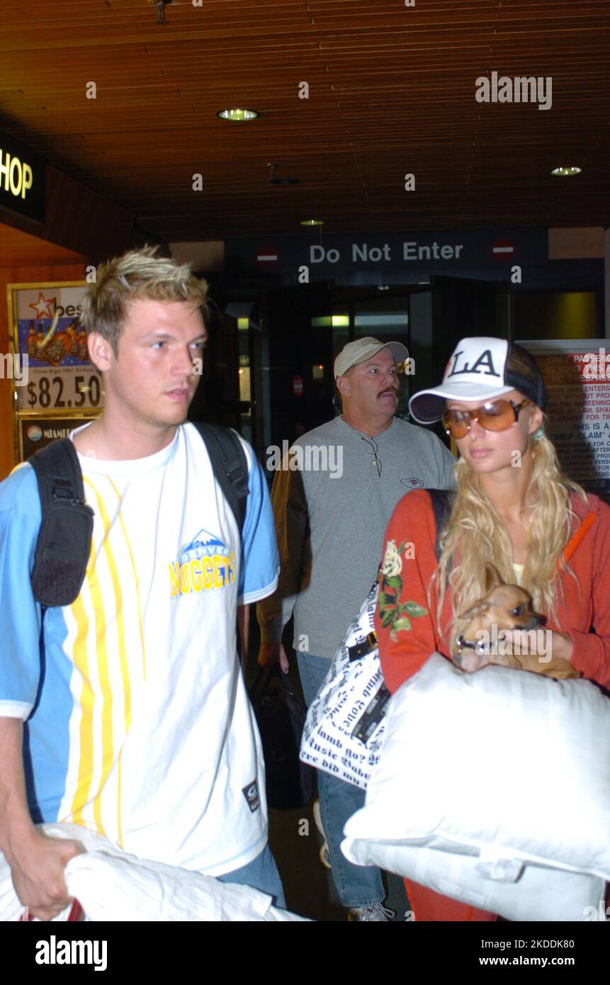 MIAMI, FL - 2004: Paris Hilton and her dog Tinker Bell along with ...