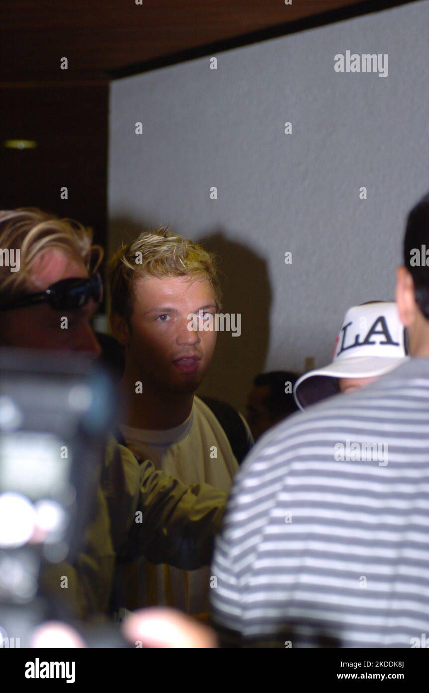 MIAMI, FL - 2004: Paris Hilton and her dog Tinker Bell along with ...