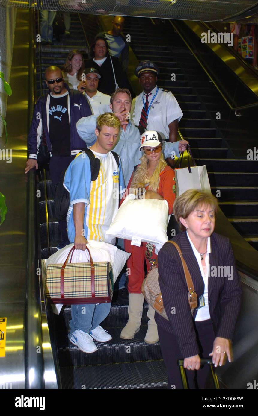 MIAMI, FL - 2004: Paris Hilton and her dog Tinker Bell along with ...