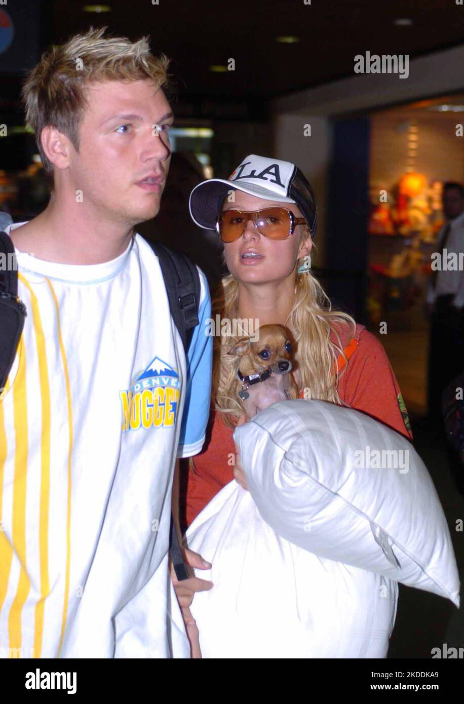 MIAMI, FL - 2004: Paris Hilton and her dog Tinker Bell along with ...
