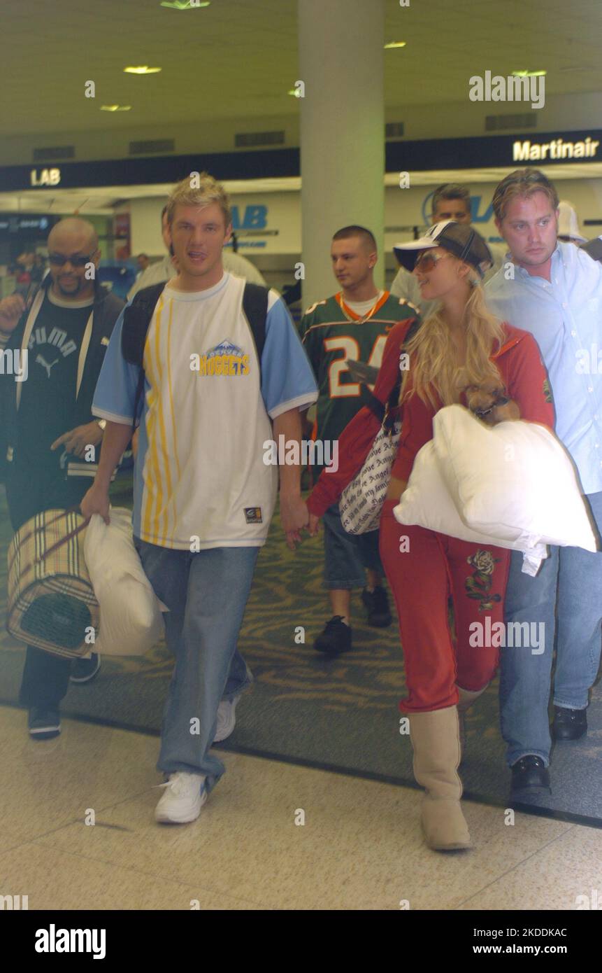 MIAMI, FL - 2004: Paris Hilton and her dog Tinker Bell along with ...