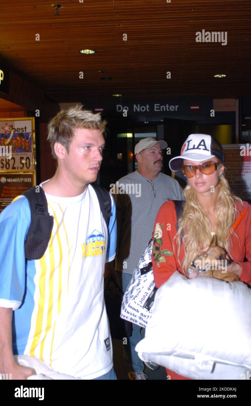 MIAMI, FL - 2004: Paris Hilton and her dog Tinker Bell along with ...