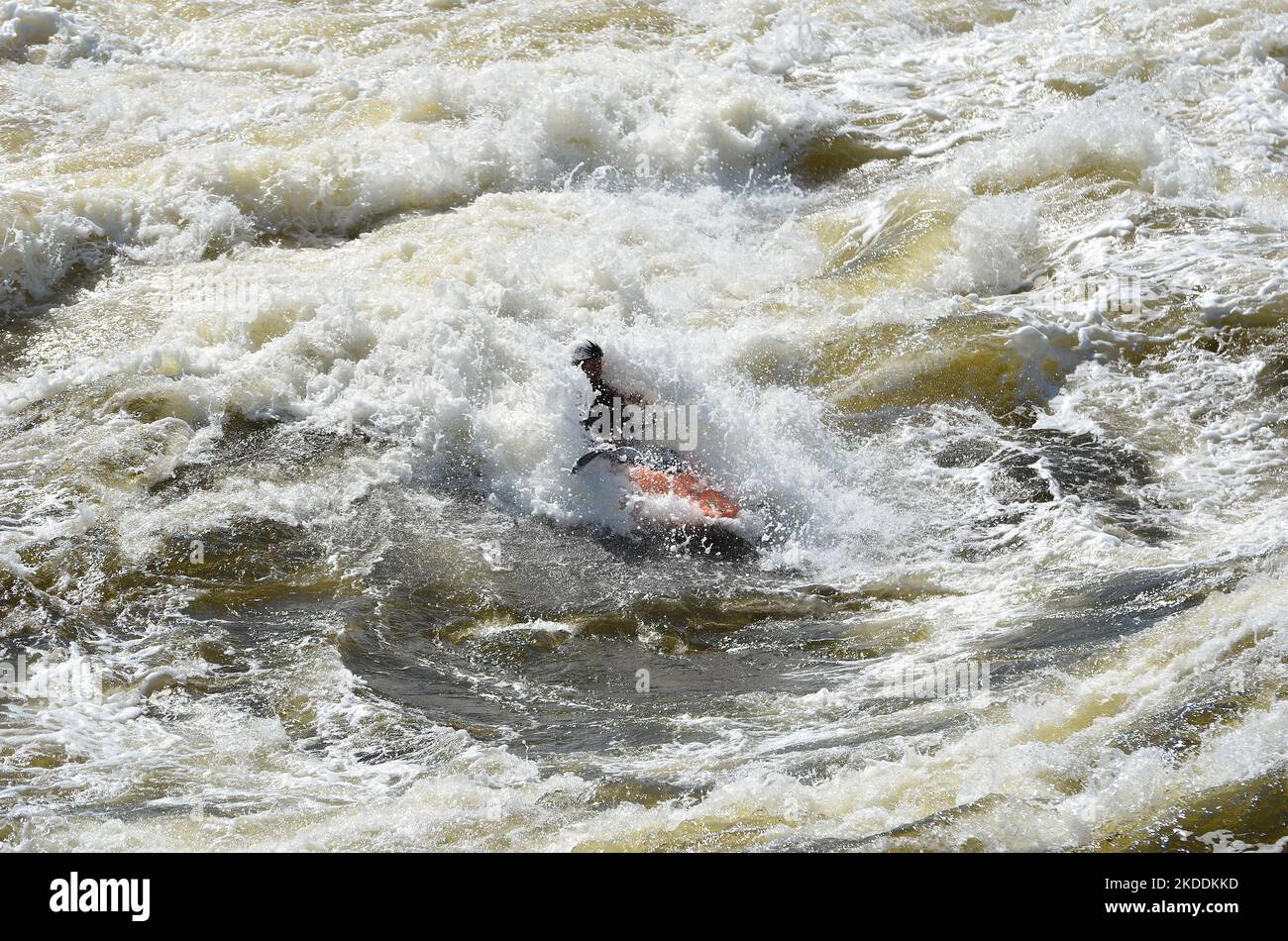 Kayaking in very rough rapids. The river is violent with a lot of ...