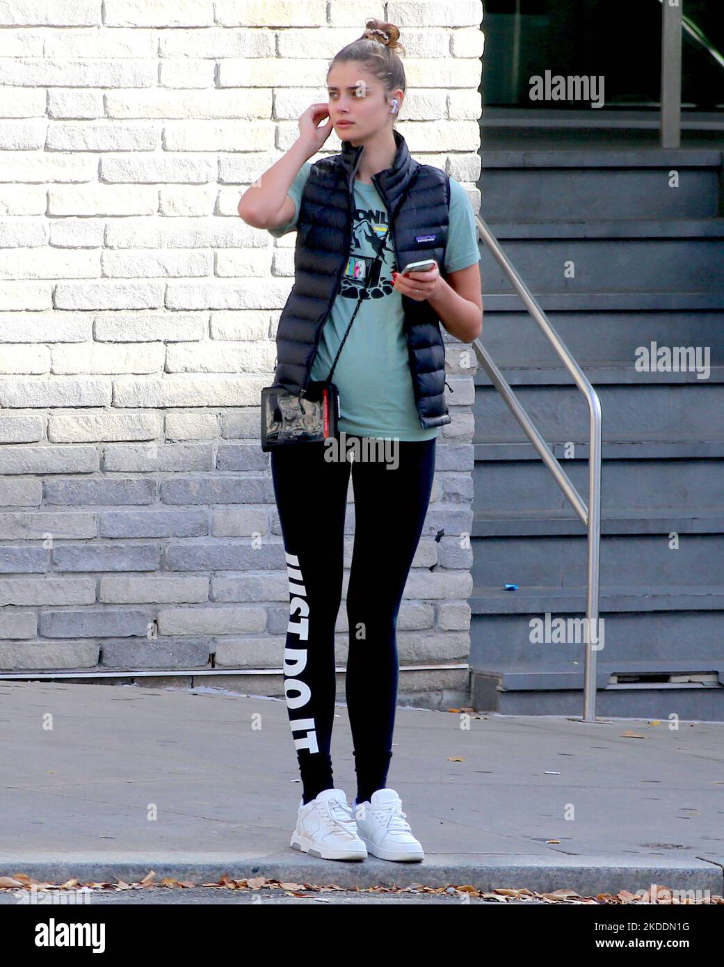 Model Taylor Hill walking early in the morining on Sixth Avenue in Soho ...
