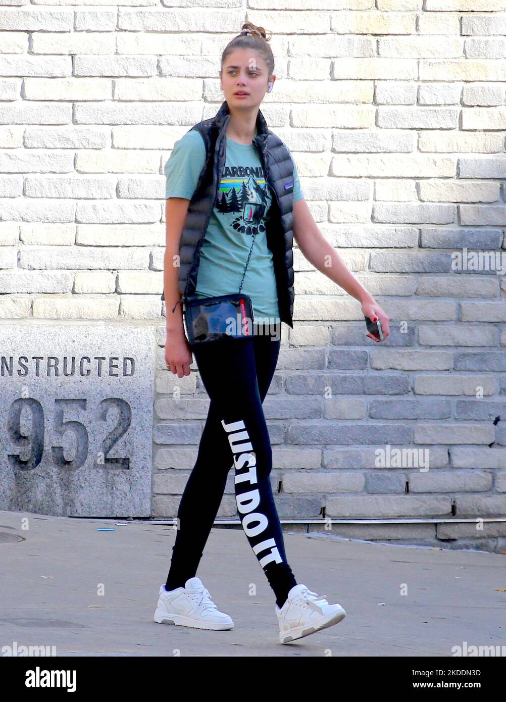 Model Taylor Hill walking early in the morining on Sixth Avenue in Soho ...