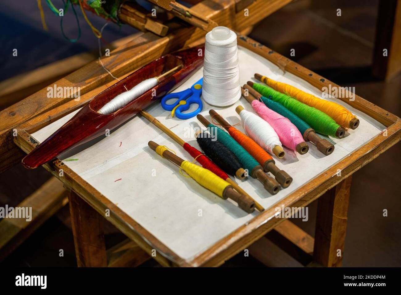 Colored bobbins used in traditional Chinese embroidery Stock Photo - Alamy