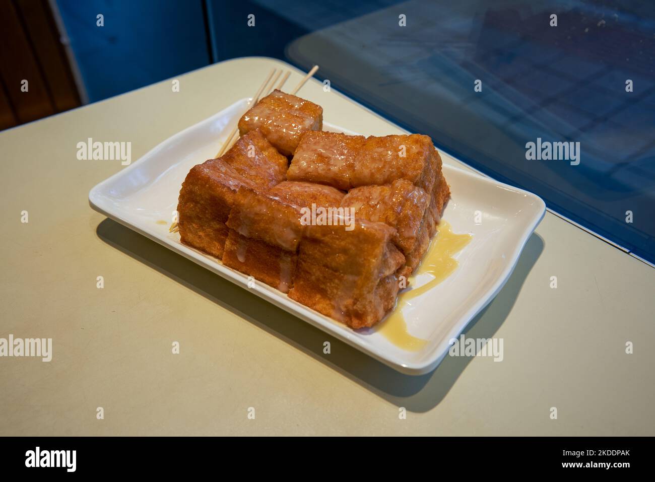 A plate of sweet and golden Hong Kong-style West Toast Bread Stock ...