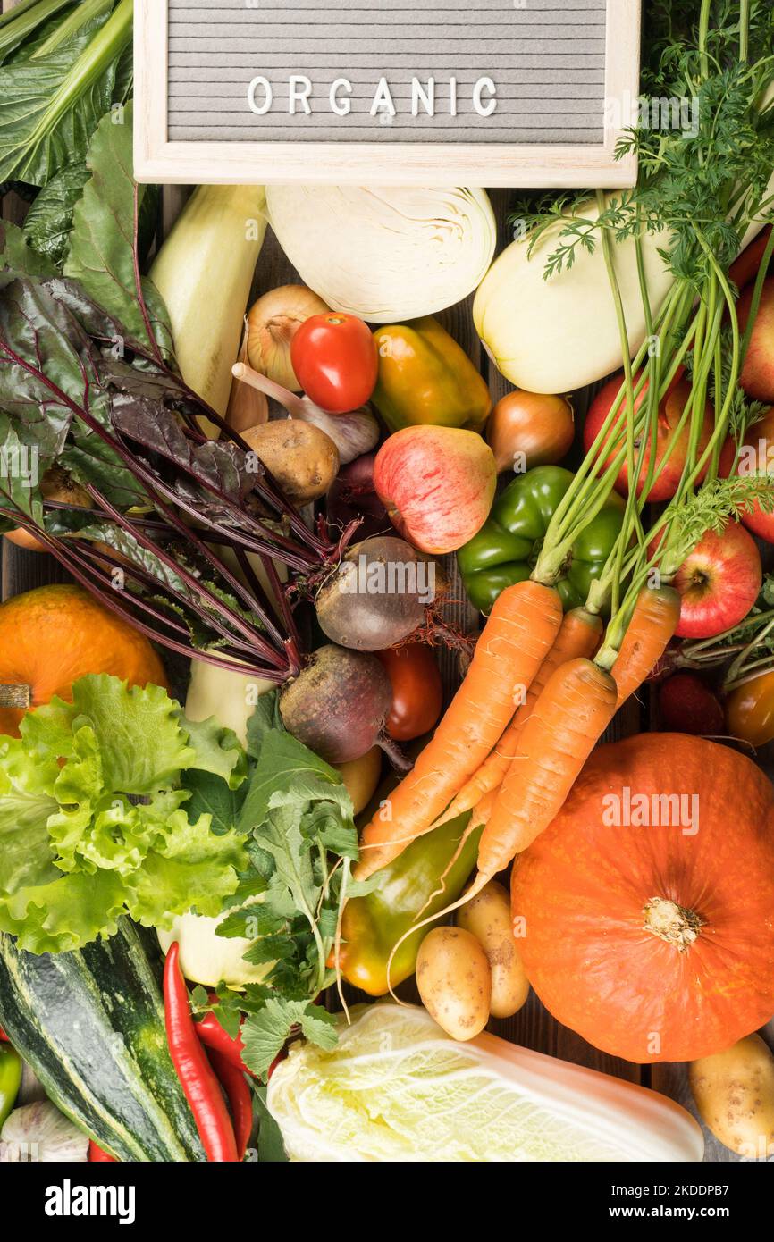 Mix of different fresh garden vegetables and fruits, top view. Table ...