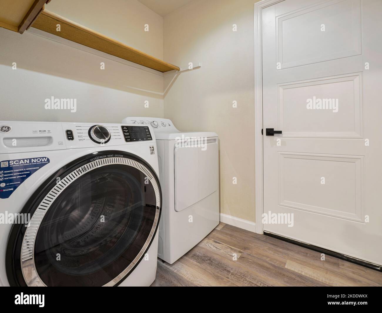 Modern residential laundry room interior Stock Photo - Alamy