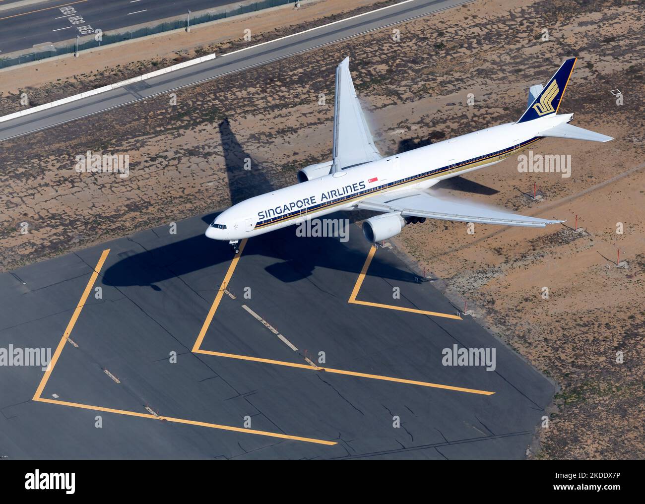 Singapore Airlines Boeing 777 airplane landing on airport runway ...