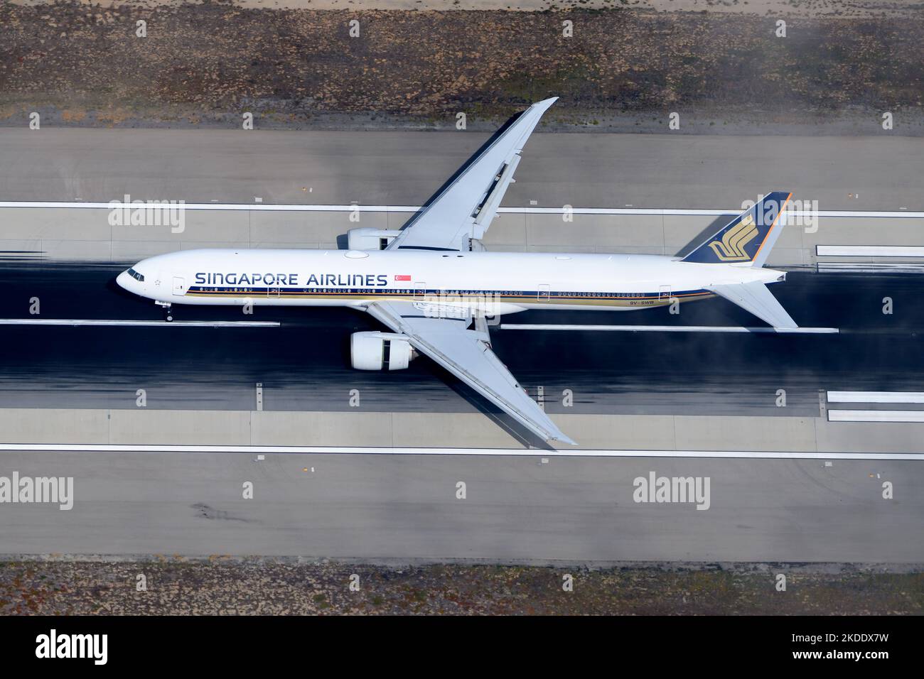 Singapore Airlines Boeing 777 aircraft landing on airport runway. Plane ...