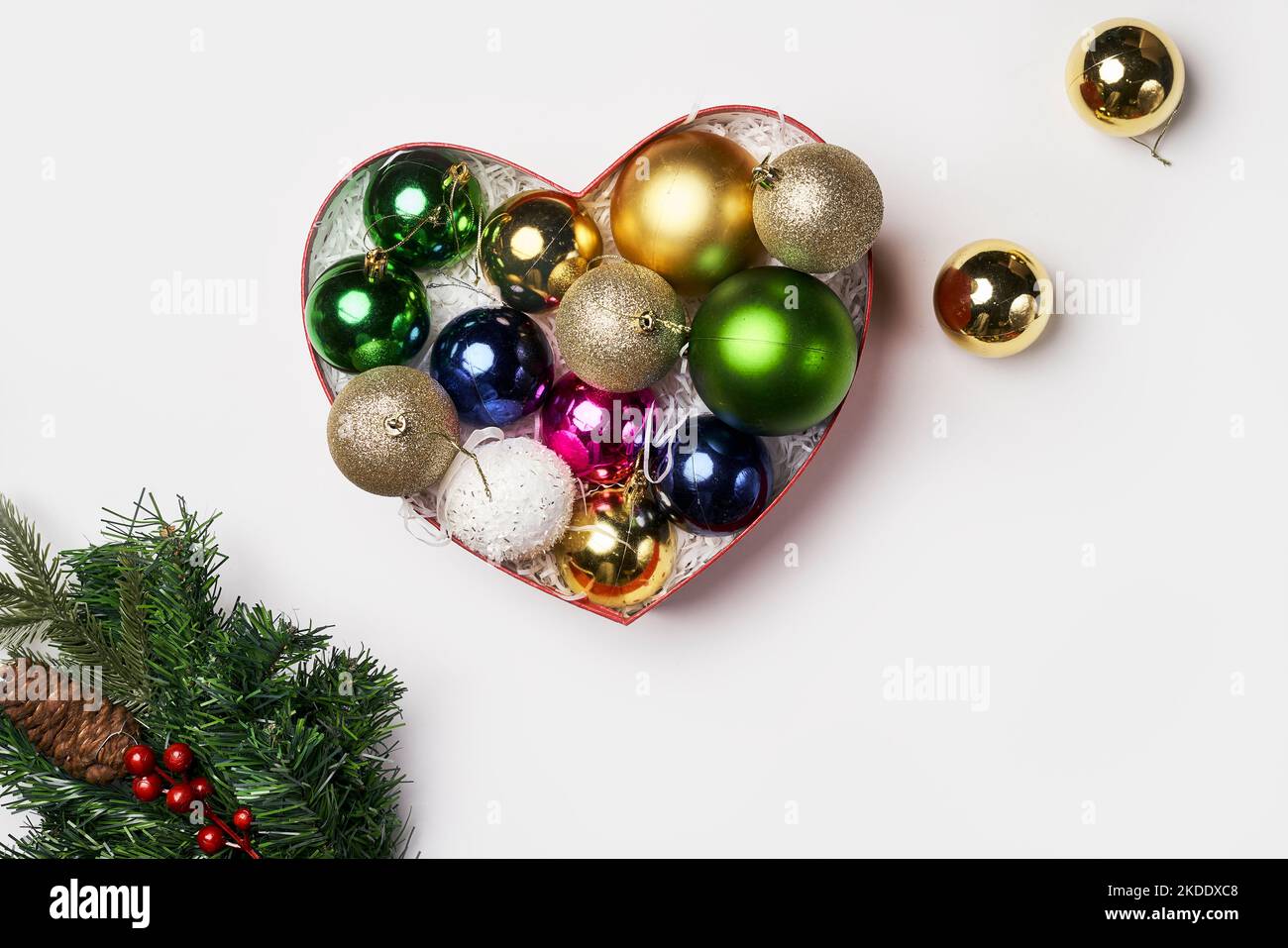 christmas ornaments in a heart shaped box on a white background with ...
