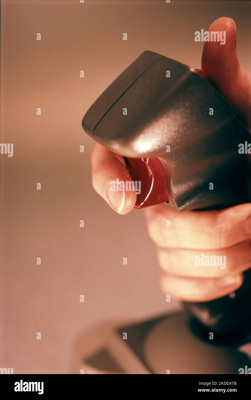 trigger finger clutching the fire button of a computer gamers flight ...