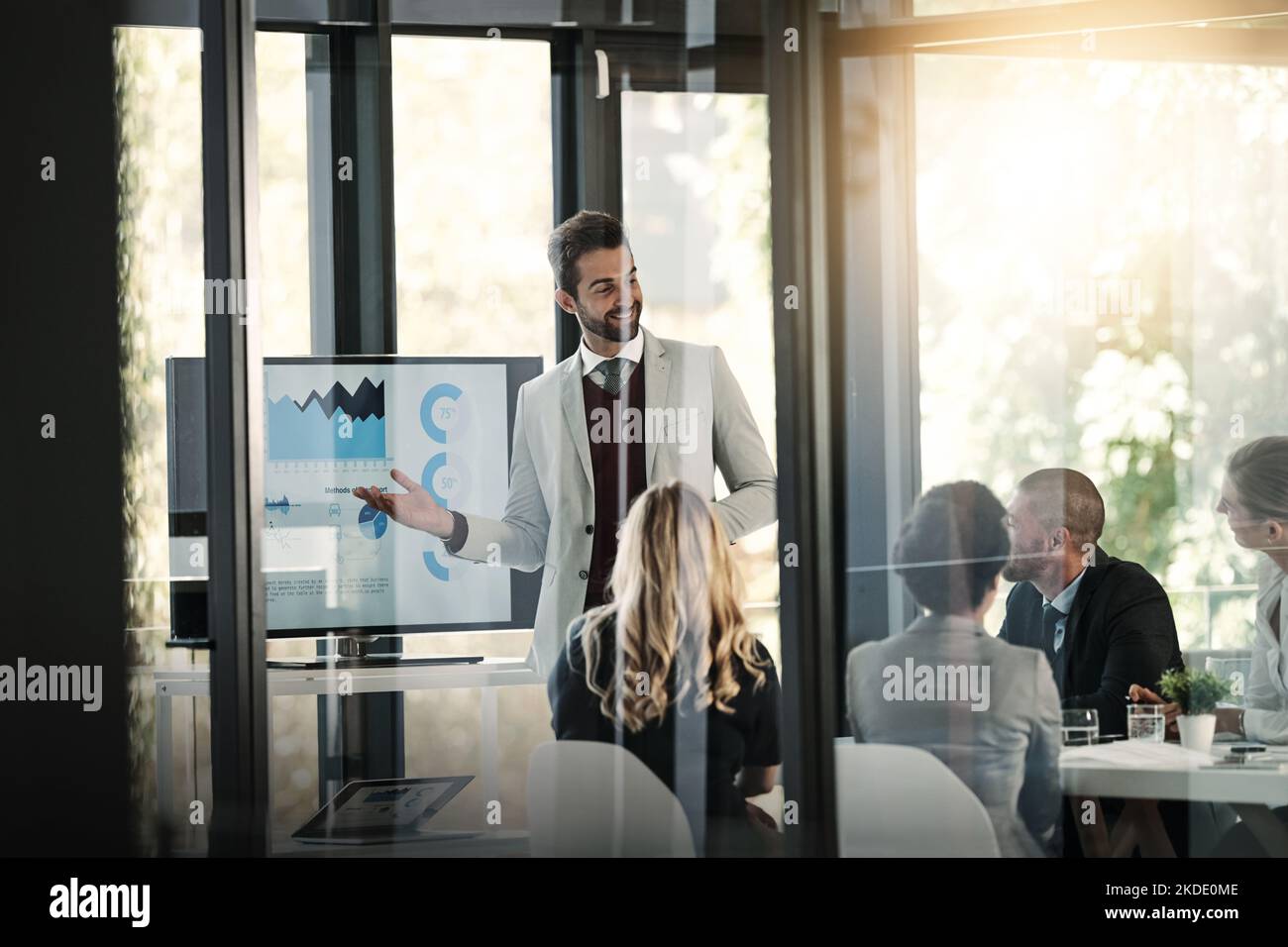 Smart execs making smart moves. a businessman delivering a presentation ...