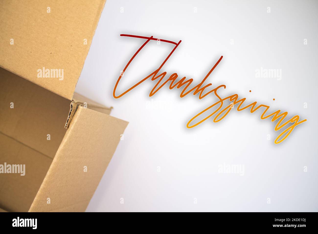 Thanksgiving word with cardboard box. Brown folded card box Stock Photo ...