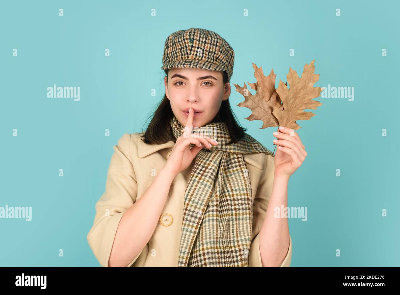 Woman with autumn leaves on isolated background with copy space Stock ...
