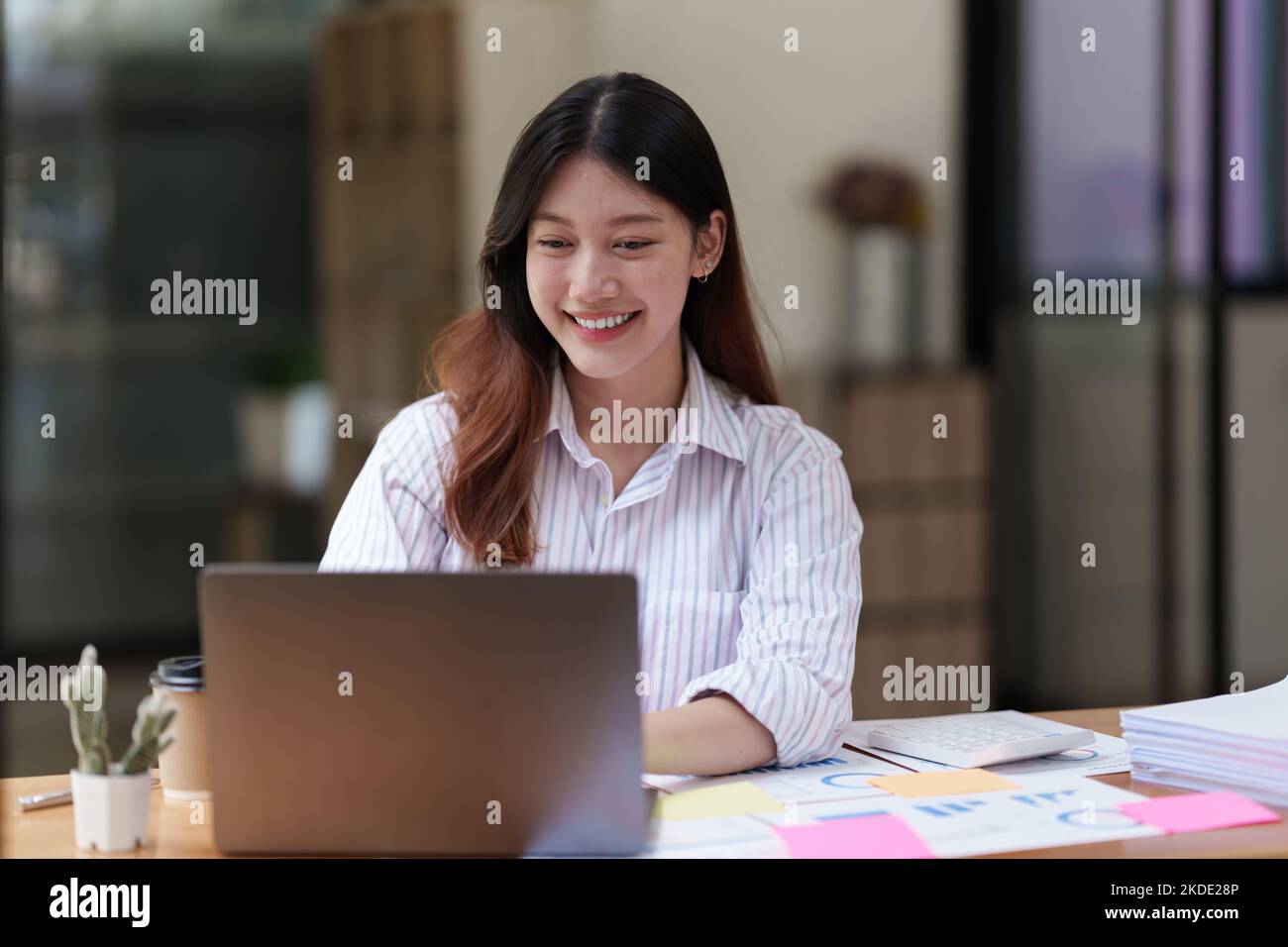 Asian Business woman working to analyze technical price graph and ...