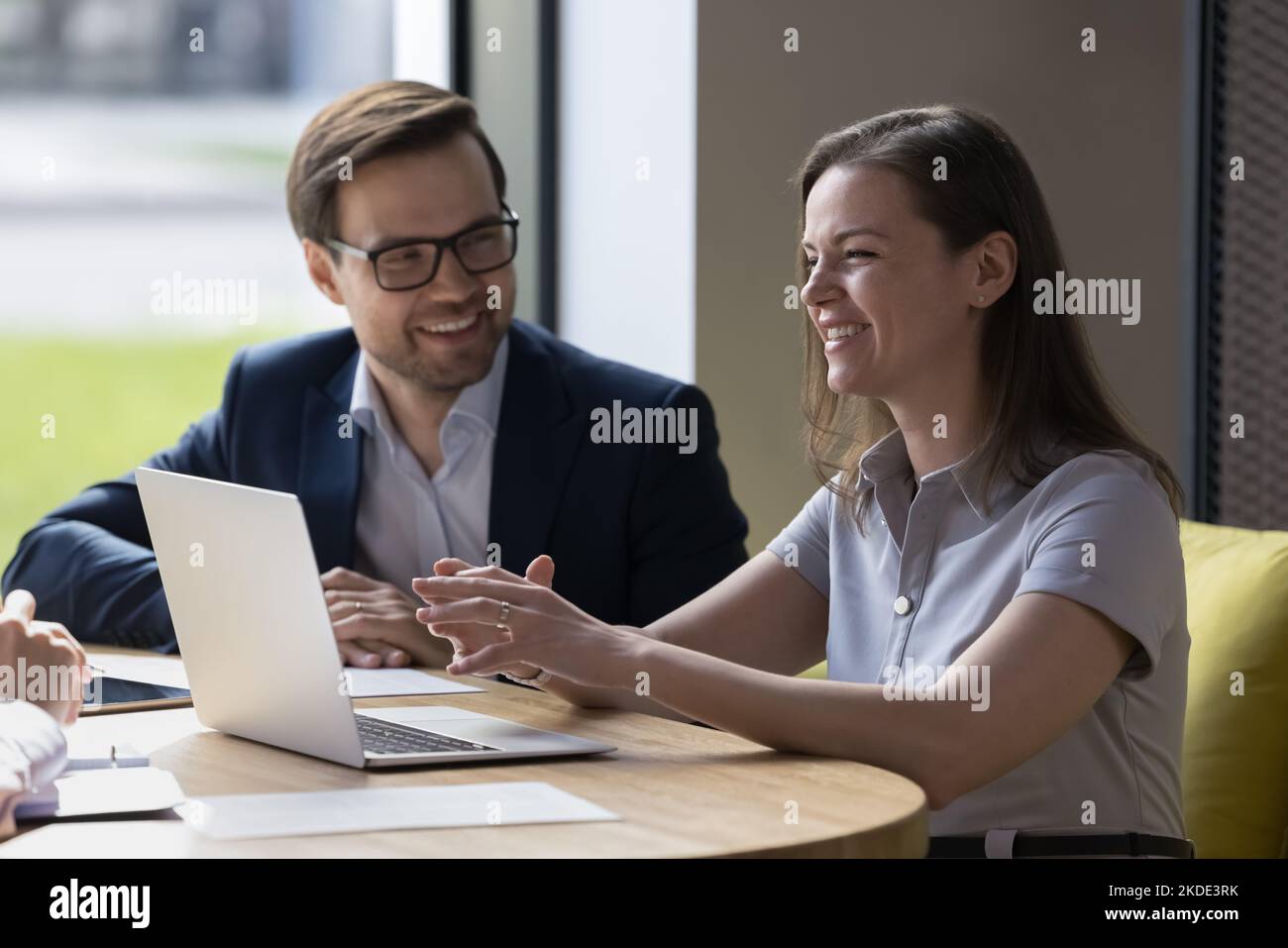 Happy positive employees working together during group meeting Stock ...