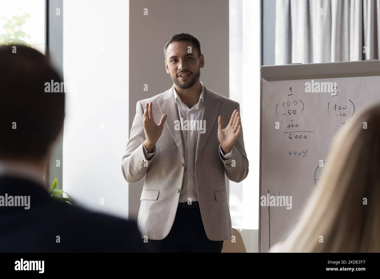 Business trainer makes speech during professional training in office ...