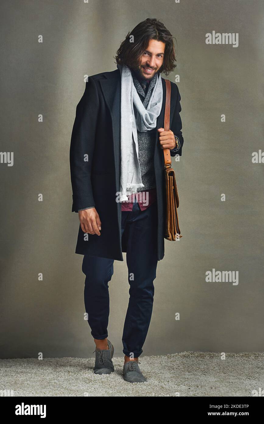 Make the world your runway. a stylishly dressed man posing with a ...