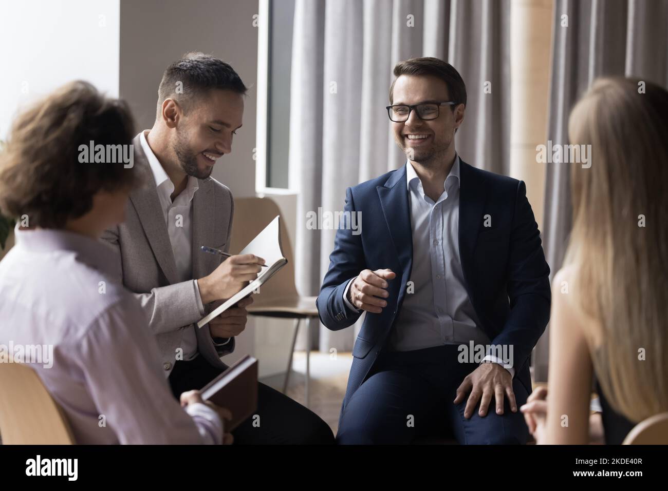 Group of smiling teammates take part in teamwork Stock Photo - Alamy