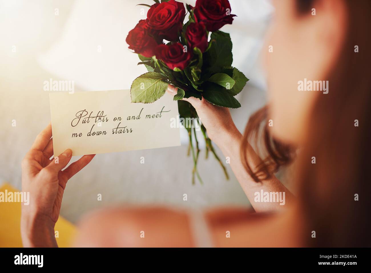 Its the small gestures that matter the most. a young woman reading a ...
