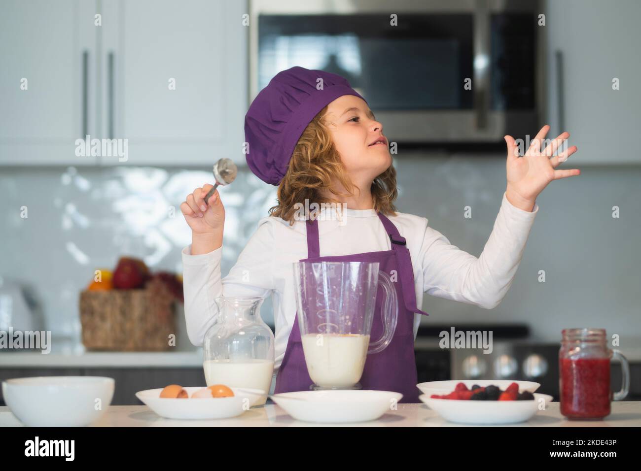 Chef child cooking healthy meal and dinner preparation. Chef kid boy in ...