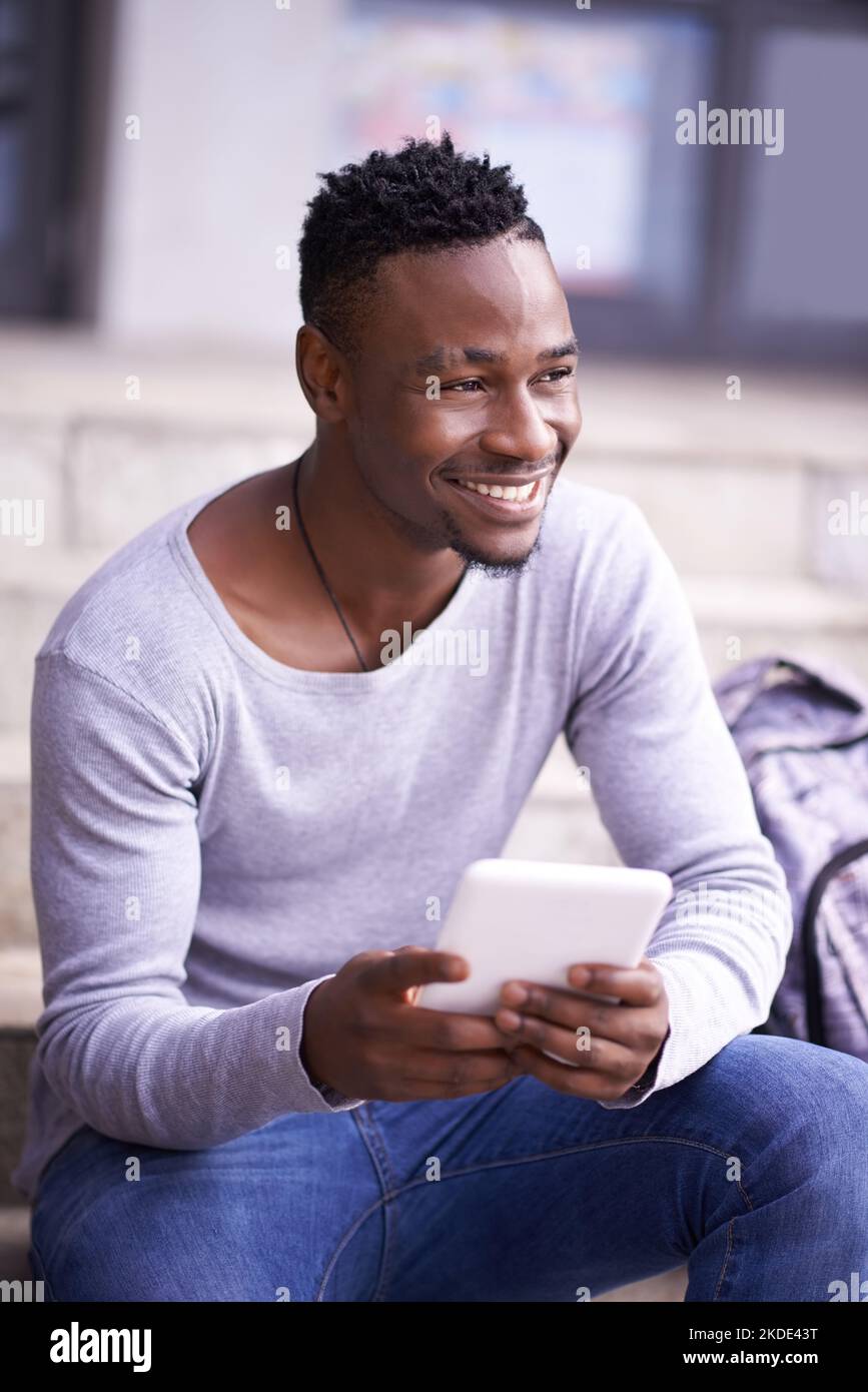 This is hands down the coolest app ever. a young man using his tablet ...