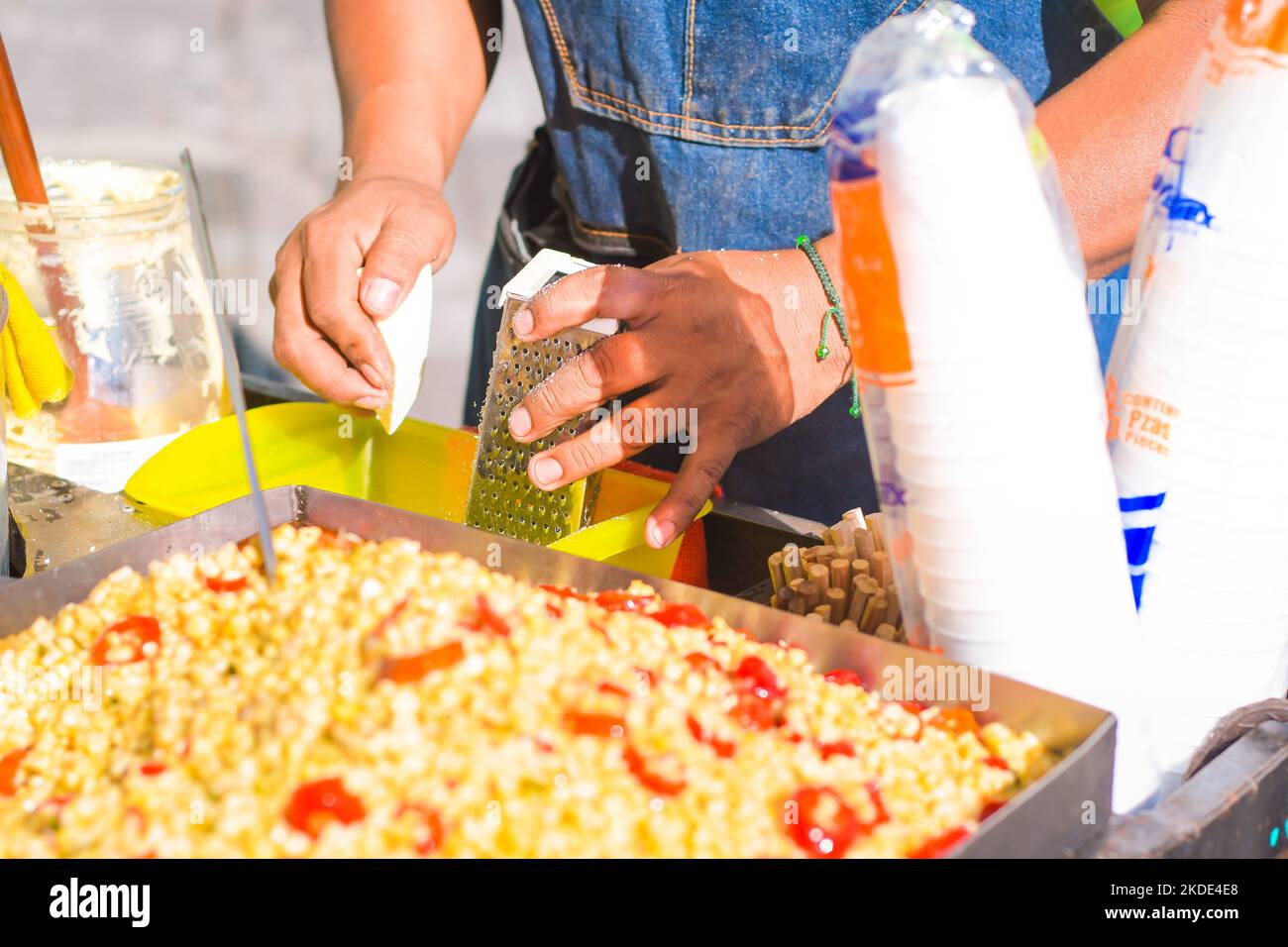 Grating Cheese for Esquites, Traditional Mexican Street Food Stock ...